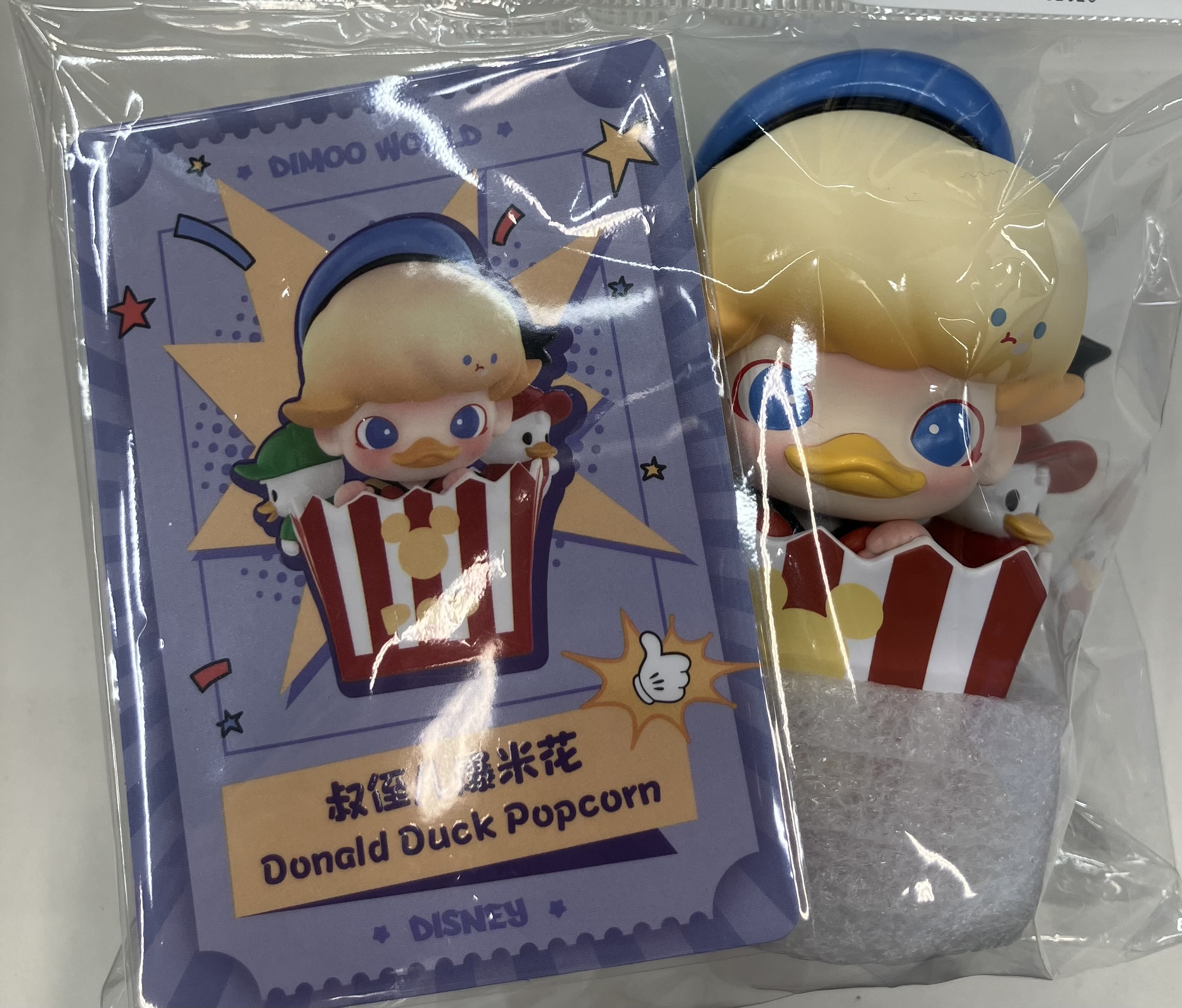 POPMART DIMOO WORLD×DISNEY シリーズ Donald Duck Popcorn 【フィギュア】[POPMART ...